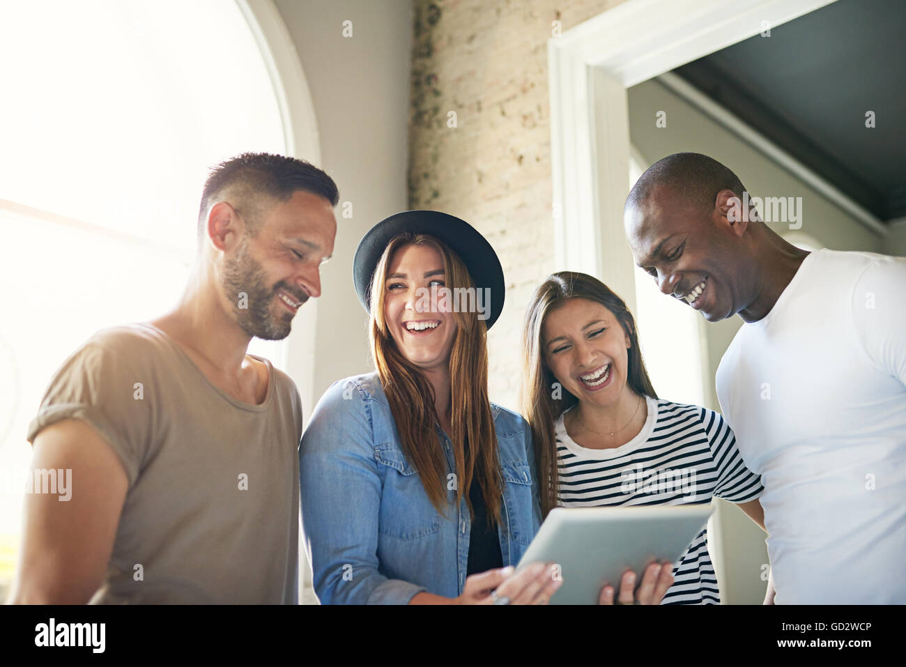 Smiling laughing young business team of diverse multiracial friends ...