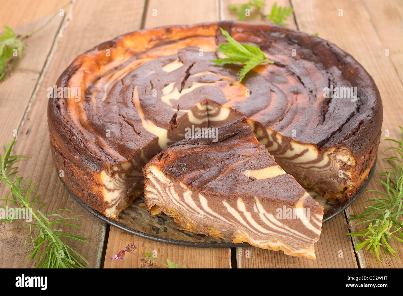 Homemade round chocolate zebra cheesecake Stock Photo - Alamy