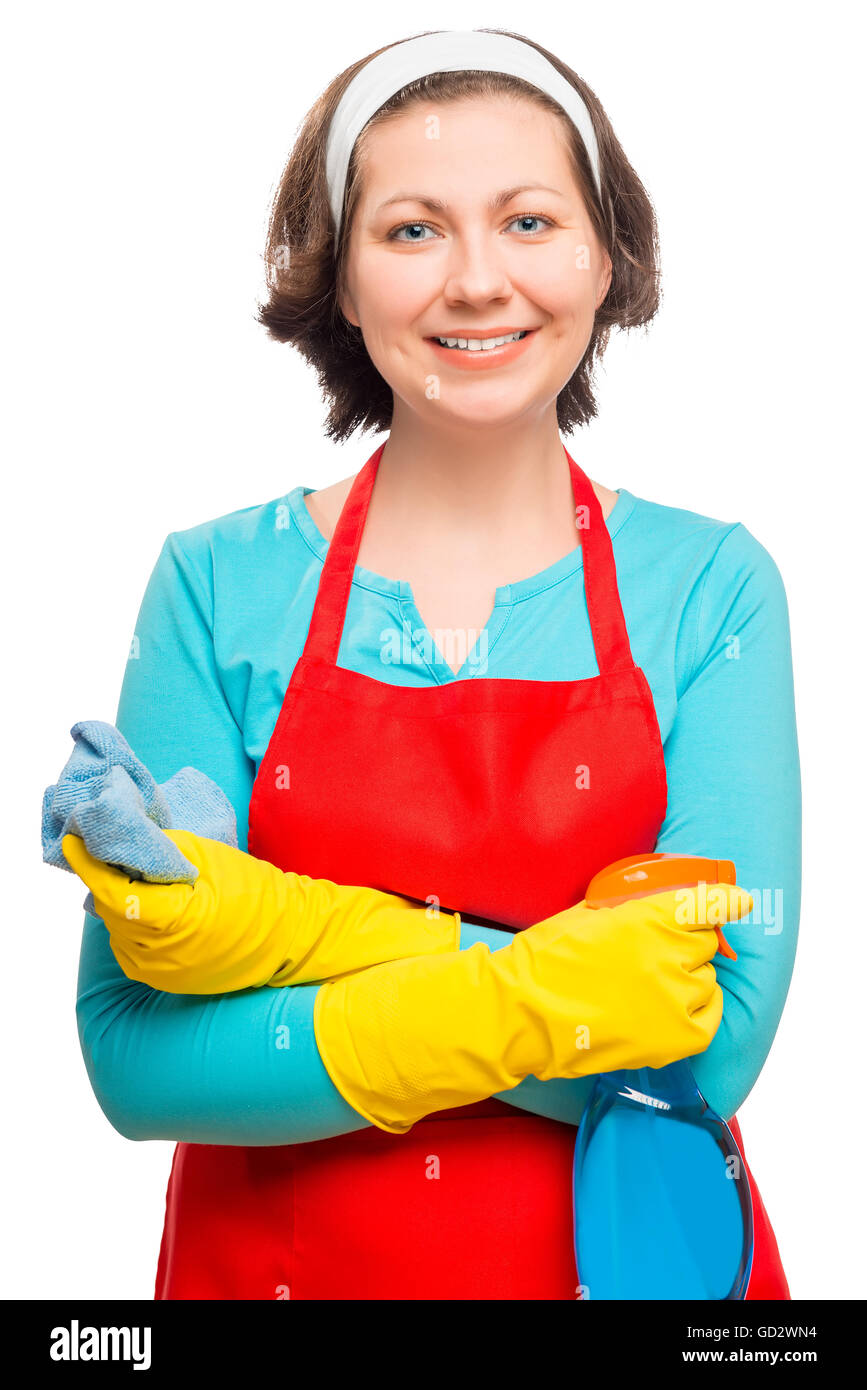 girl in apron posing with a rag and spray in hand on white background ...