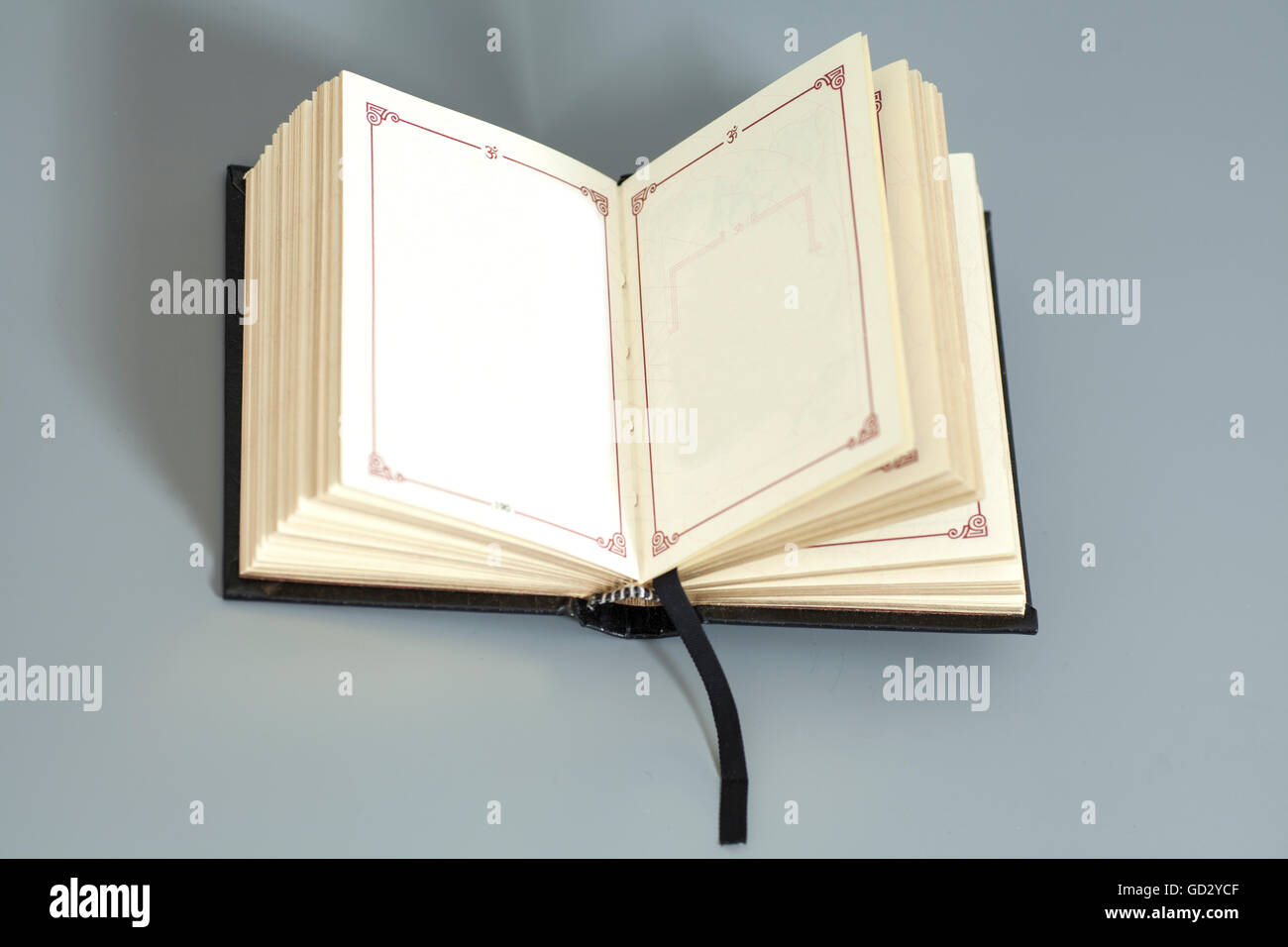 Open book on gray background Stock Photo - Alamy
