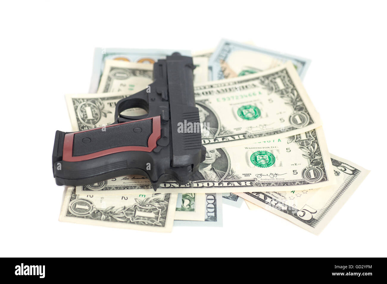 Gun on US dollar banknotes isolated on white Stock Photo - Alamy