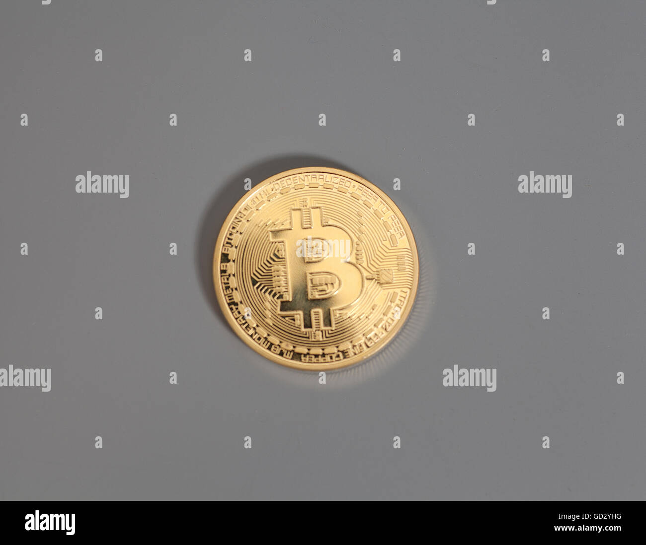 Golden Bitcoin coin isolated on gray background Stock Photo - Alamy