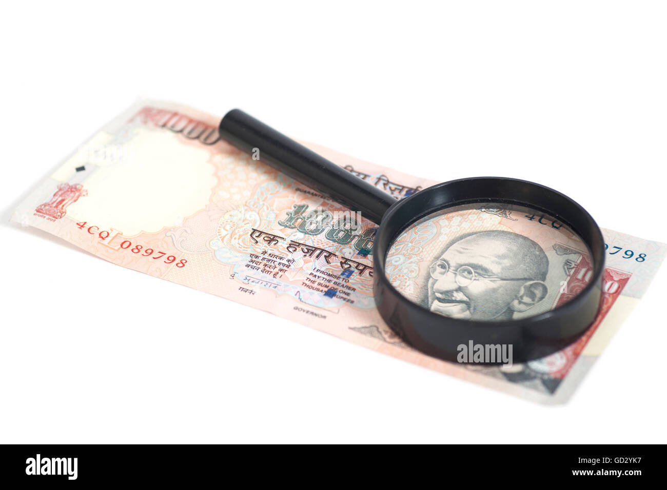 Indian Currency Rupee Note with magnifying glass isolated on white ...