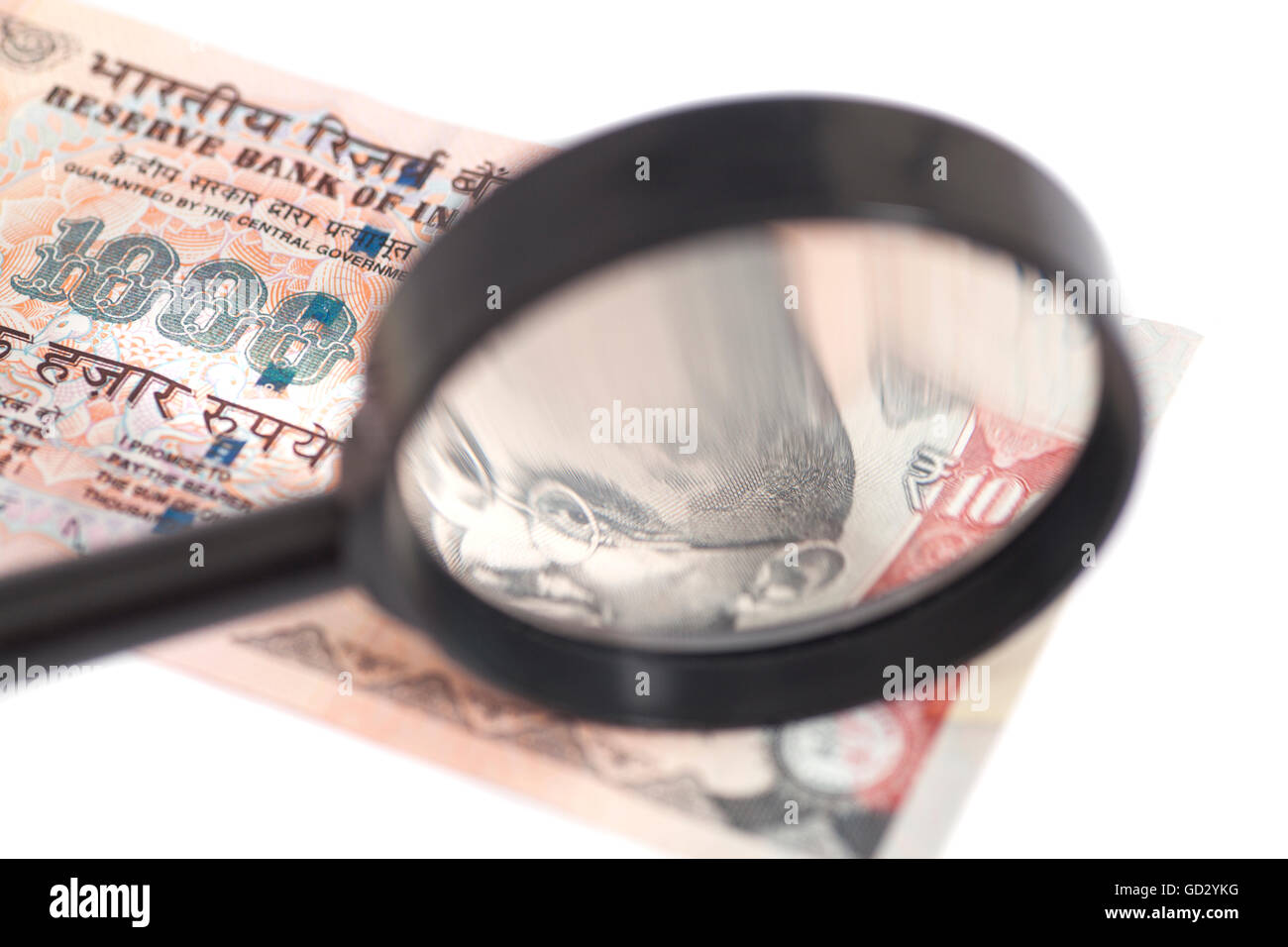 Indian Currency Rupee Note with magnifying glass isolated on white ...