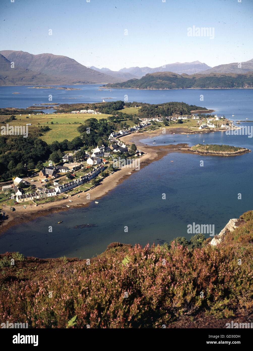 Scotland, Ross. Incoming tide on the crofting village of Plockton ...