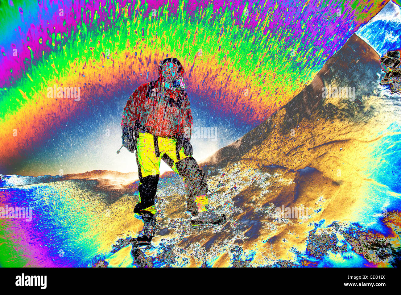 A climber being blasted by spindrift during high winds moving snow ...