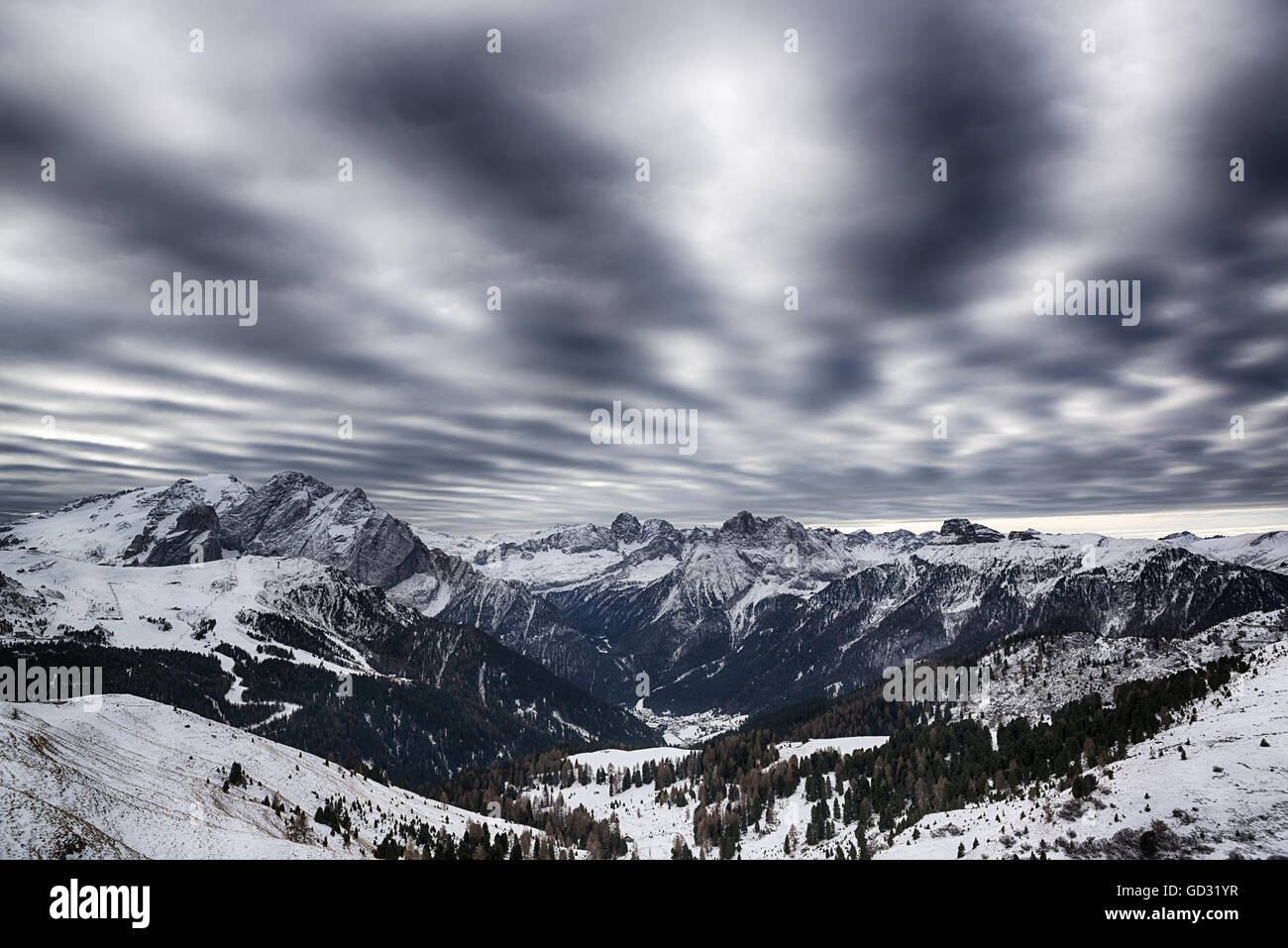 Landscape of the italian alps in a winter morning with amazing cloudy ...