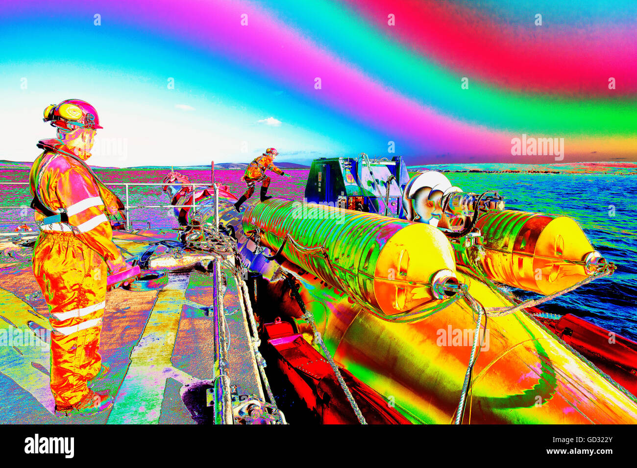 Workman preparing to tow a Pelamis P2 wave energy generator on the ...