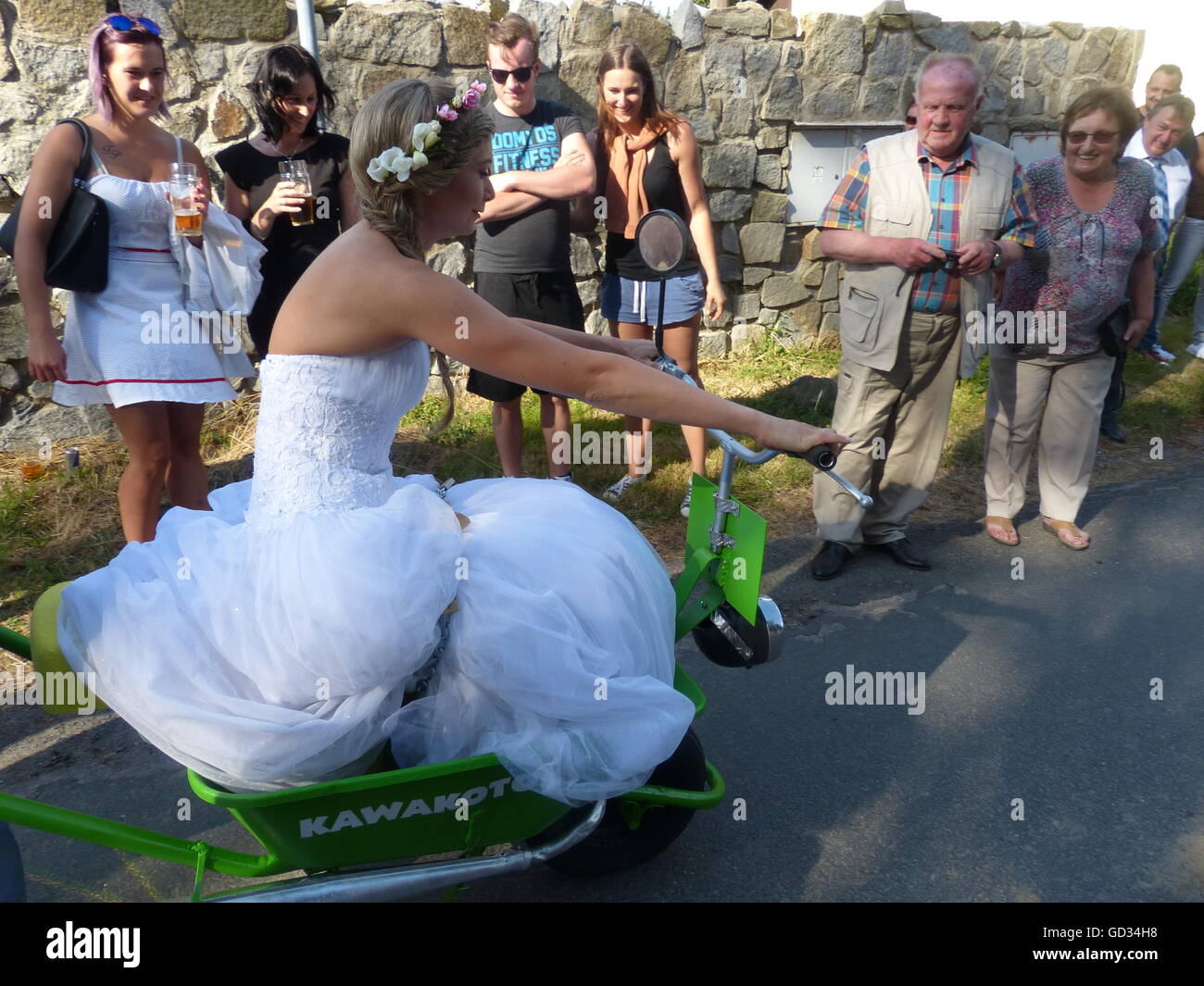 Traditional wheelbarrow run when bride is locked by chain during ...