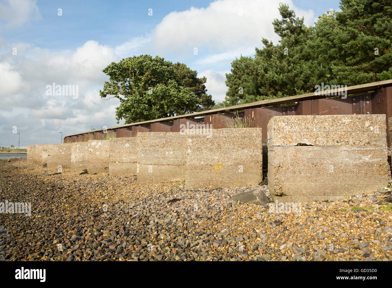 WWII anti tank defense. Blocks of concrete lining the beach head on the ...