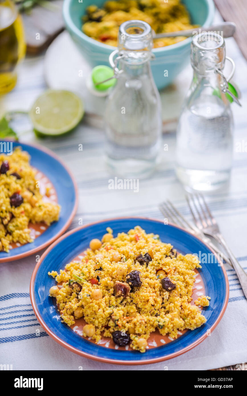eating traditional couscous salad, served on authentic plates Stock ...