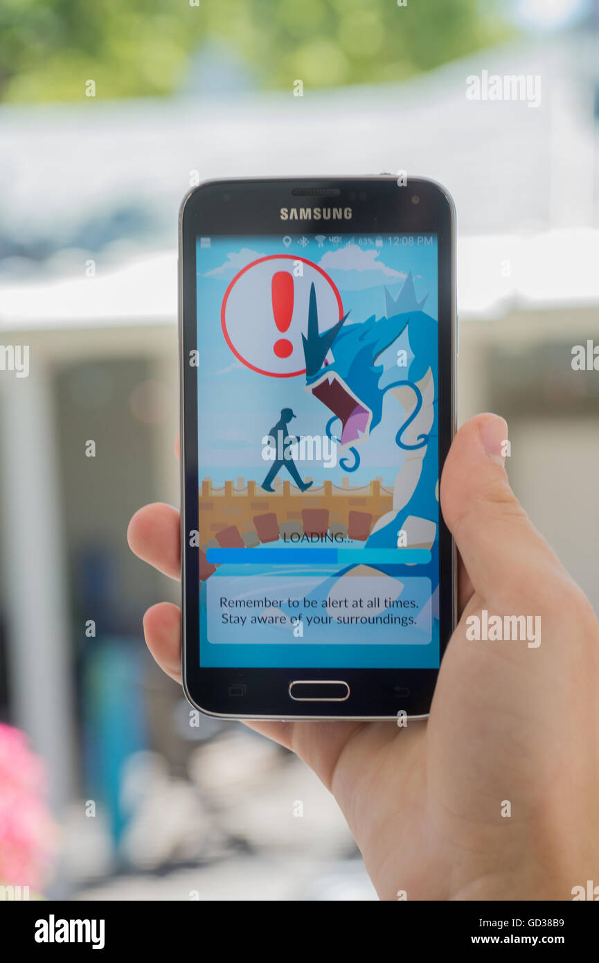 Android user plays Pokemon Go, a free-to-play augmented reality mobile ...