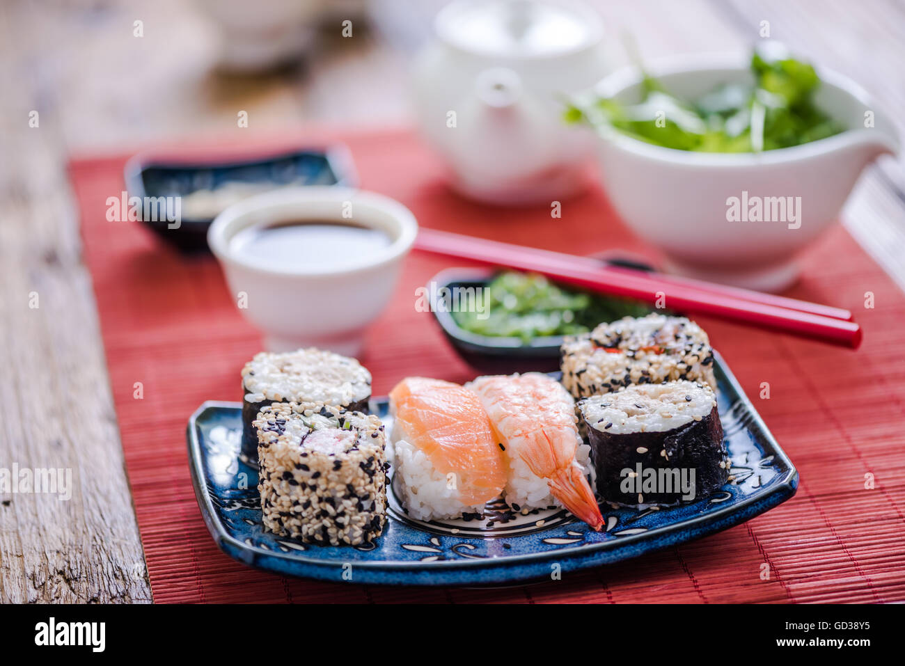 eating sushi, low angle with bright background Stock Photo - Alamy