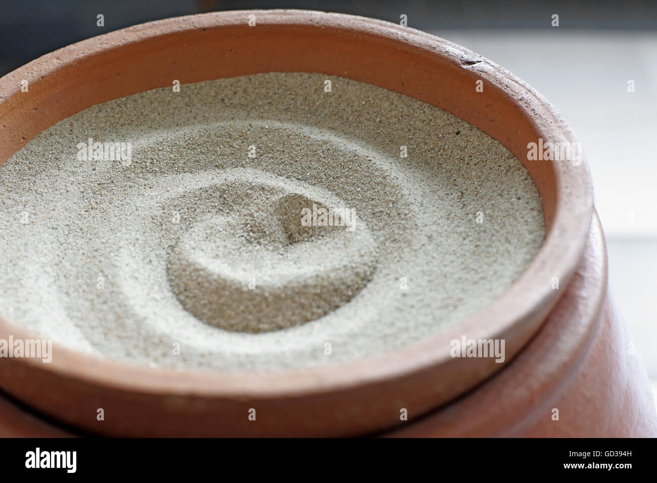 a empty sand ashtray with circle pattern Stock Photo - Alamy