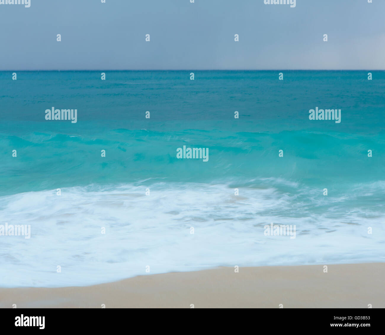 Waves on sandy sea beach hi-res stock photography and images - Alamy