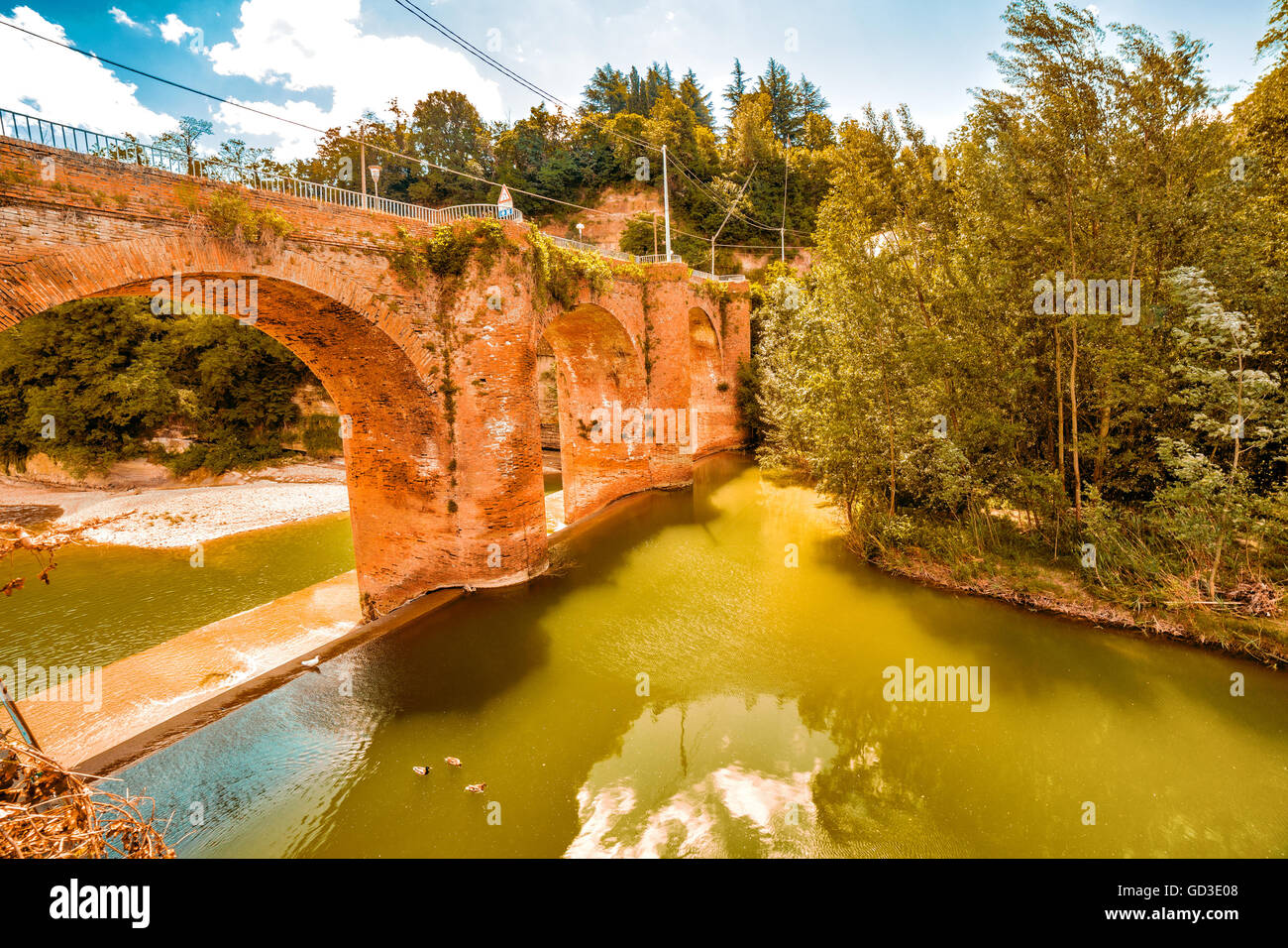 fourteenth century bridge in masonry over the River in a small village ...