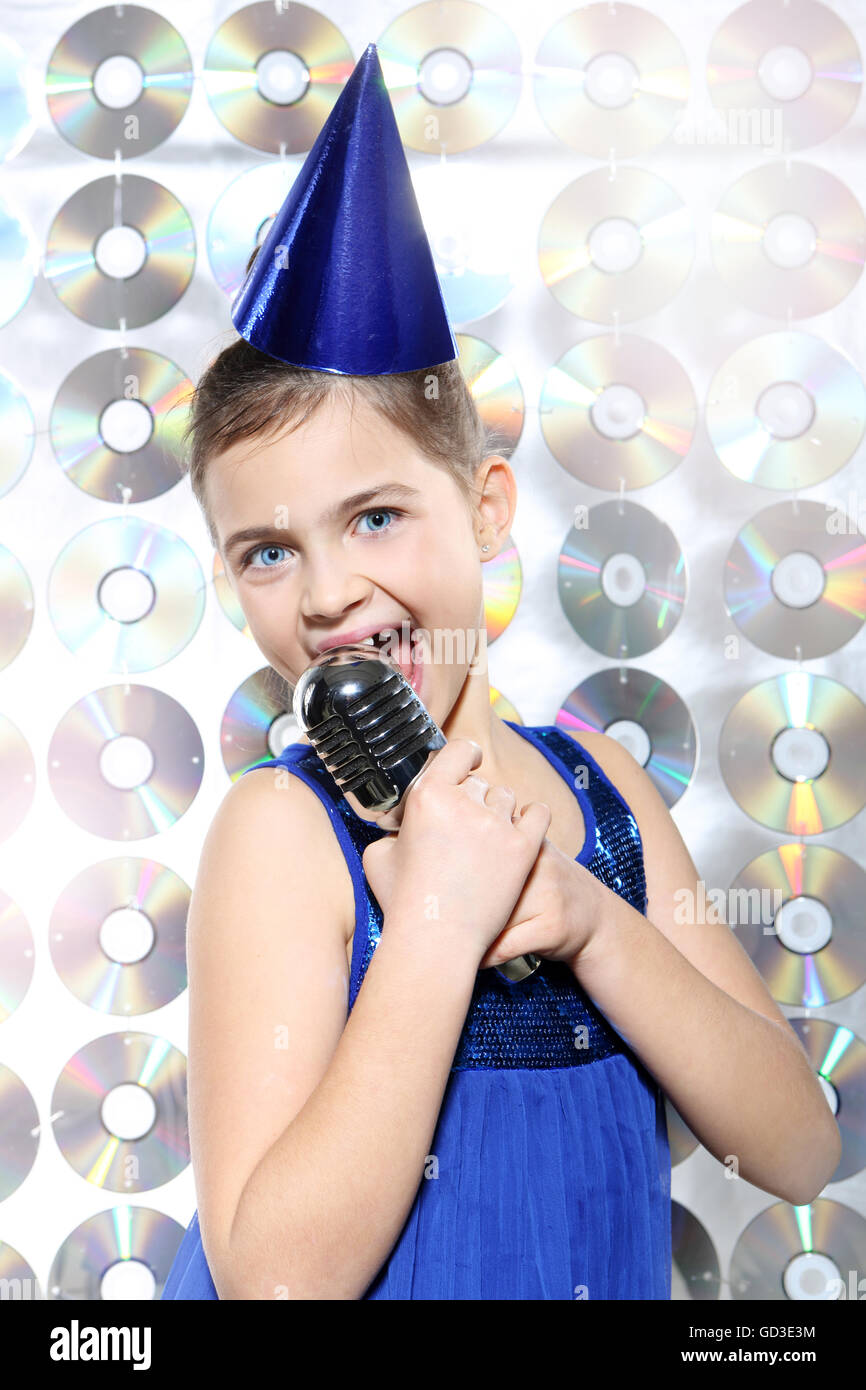 Child, teen, girl, singing into a microphone, a small singer Stock ...