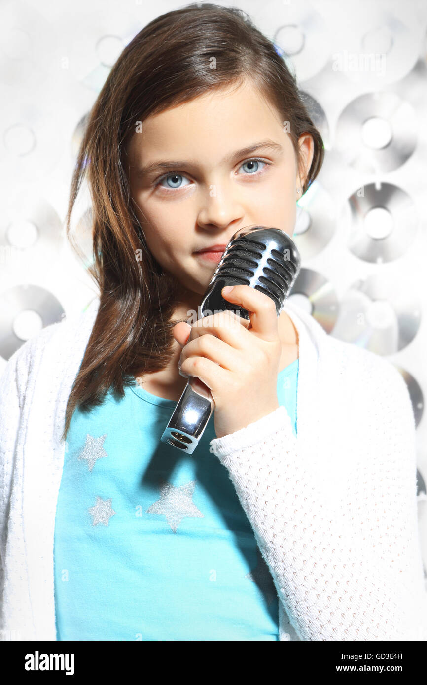 Child teen girl singing microphone hi-res stock photography and images - Alamy