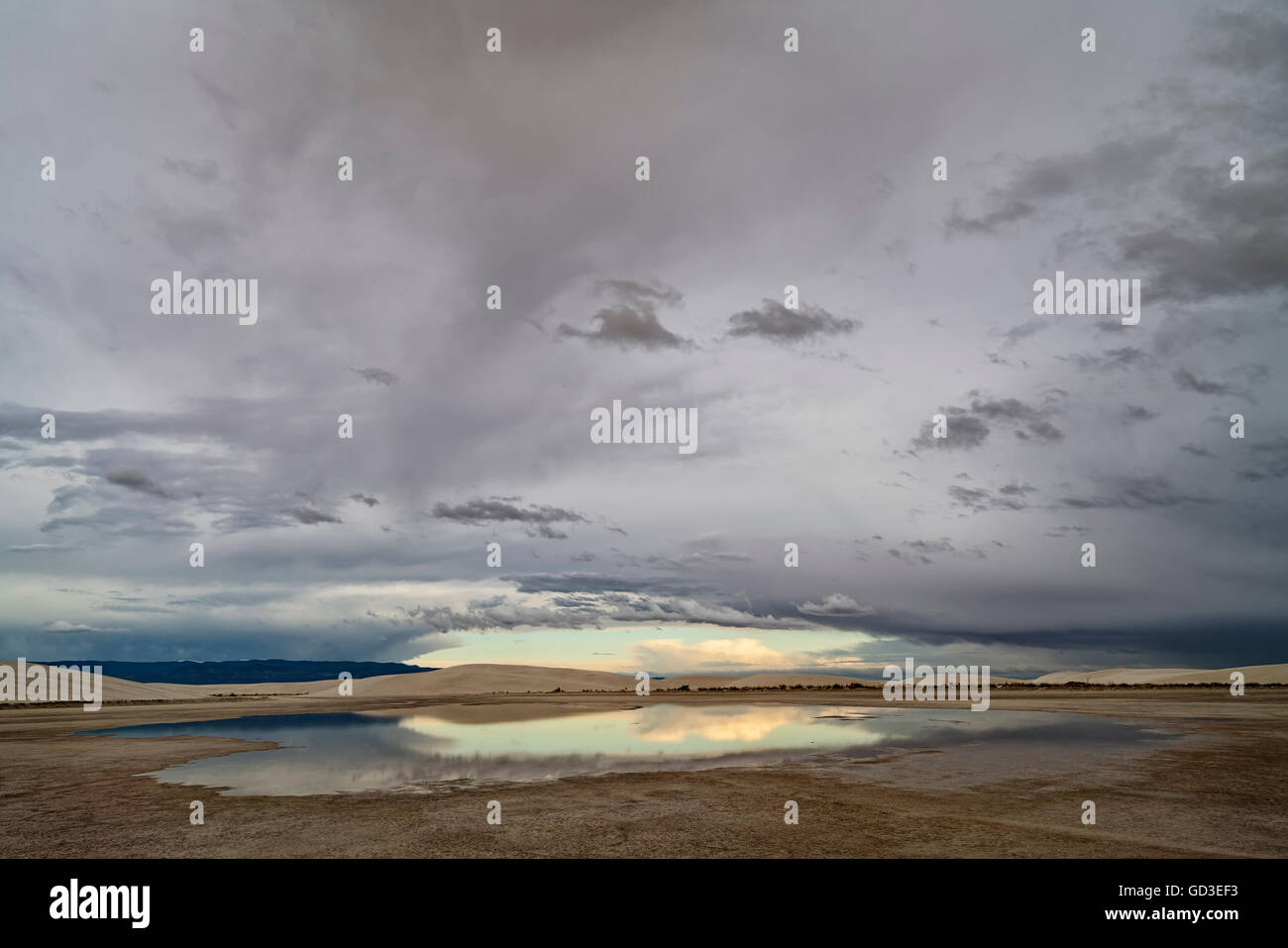 Puddle of water in the desert Stock Photo - Alamy