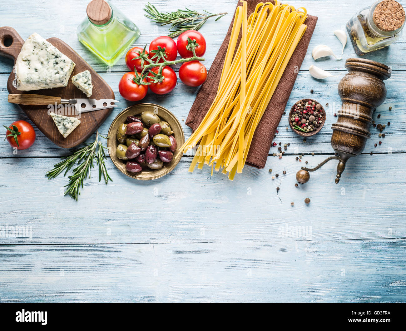 Pasta ingredients. Cherry-tomatoes, spaghetti pasta, rosemary and ...