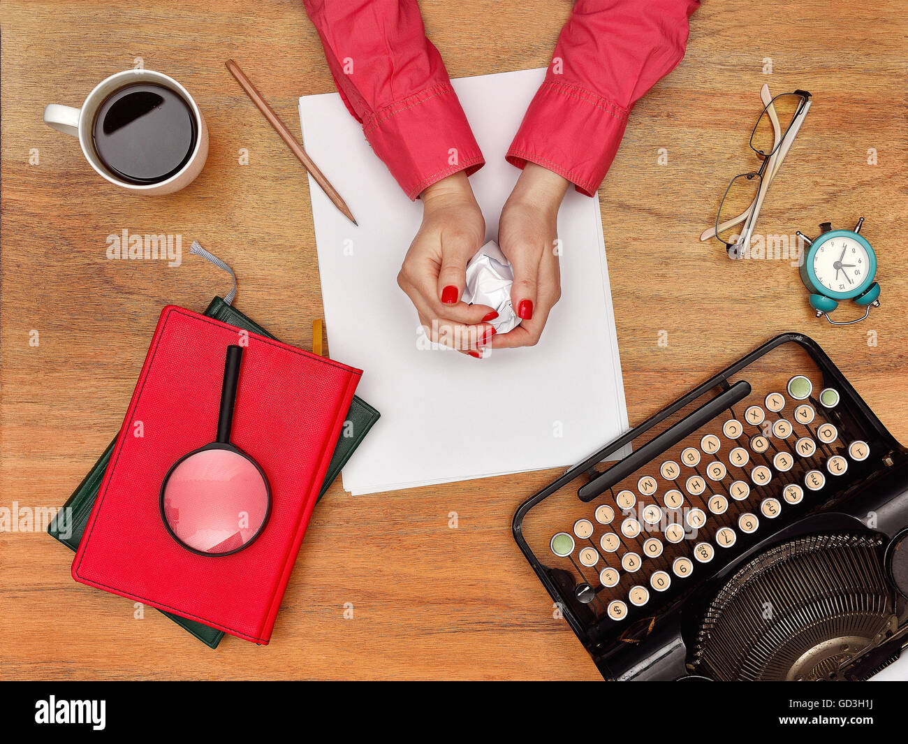 Woman writer crumpled sheet of paper. View from above Stock Photo - Alamy