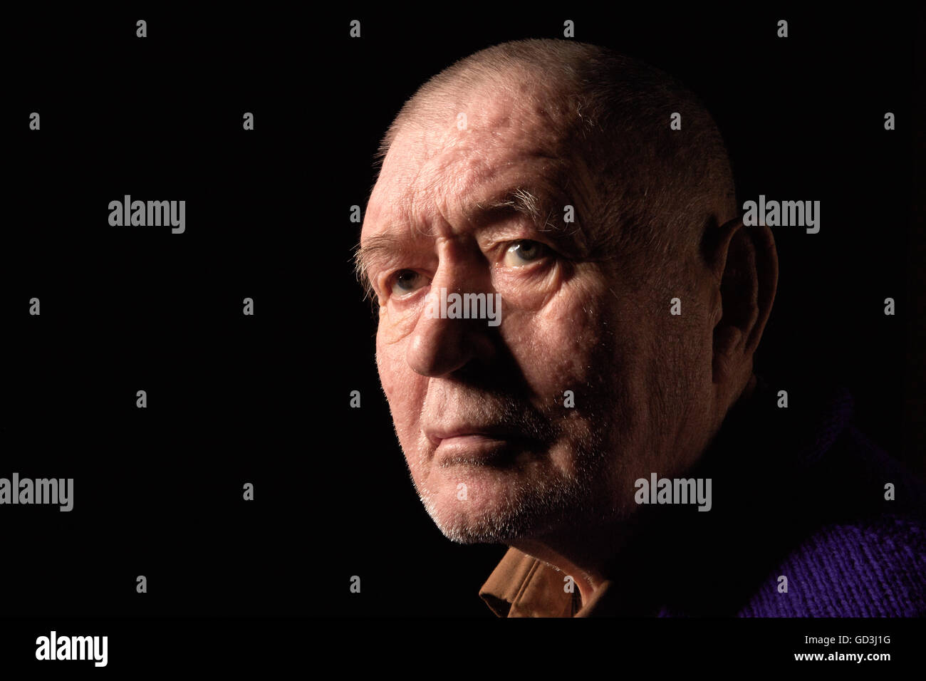 serious old man senior on black background Stock Photo - Alamy