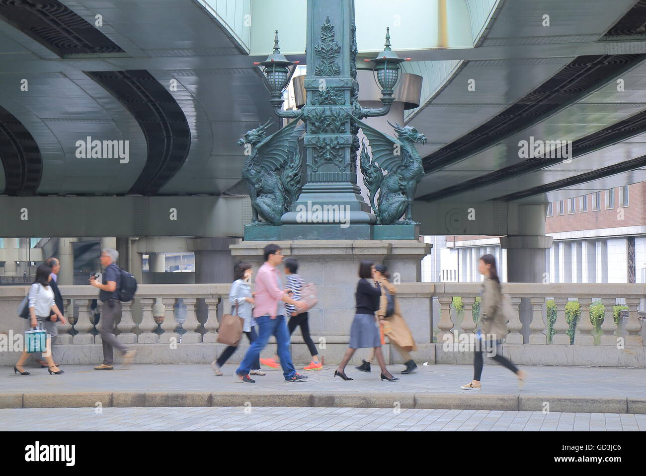 People cross Nihonbashi bridge in Tokyo Japan Stock Photo - Alamy