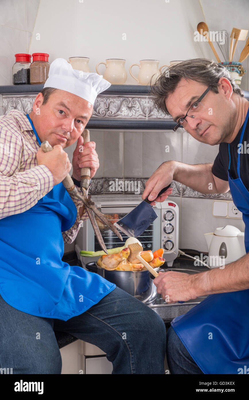 Too many cooks spoil the broth, a conceptual shot with two useless male ...