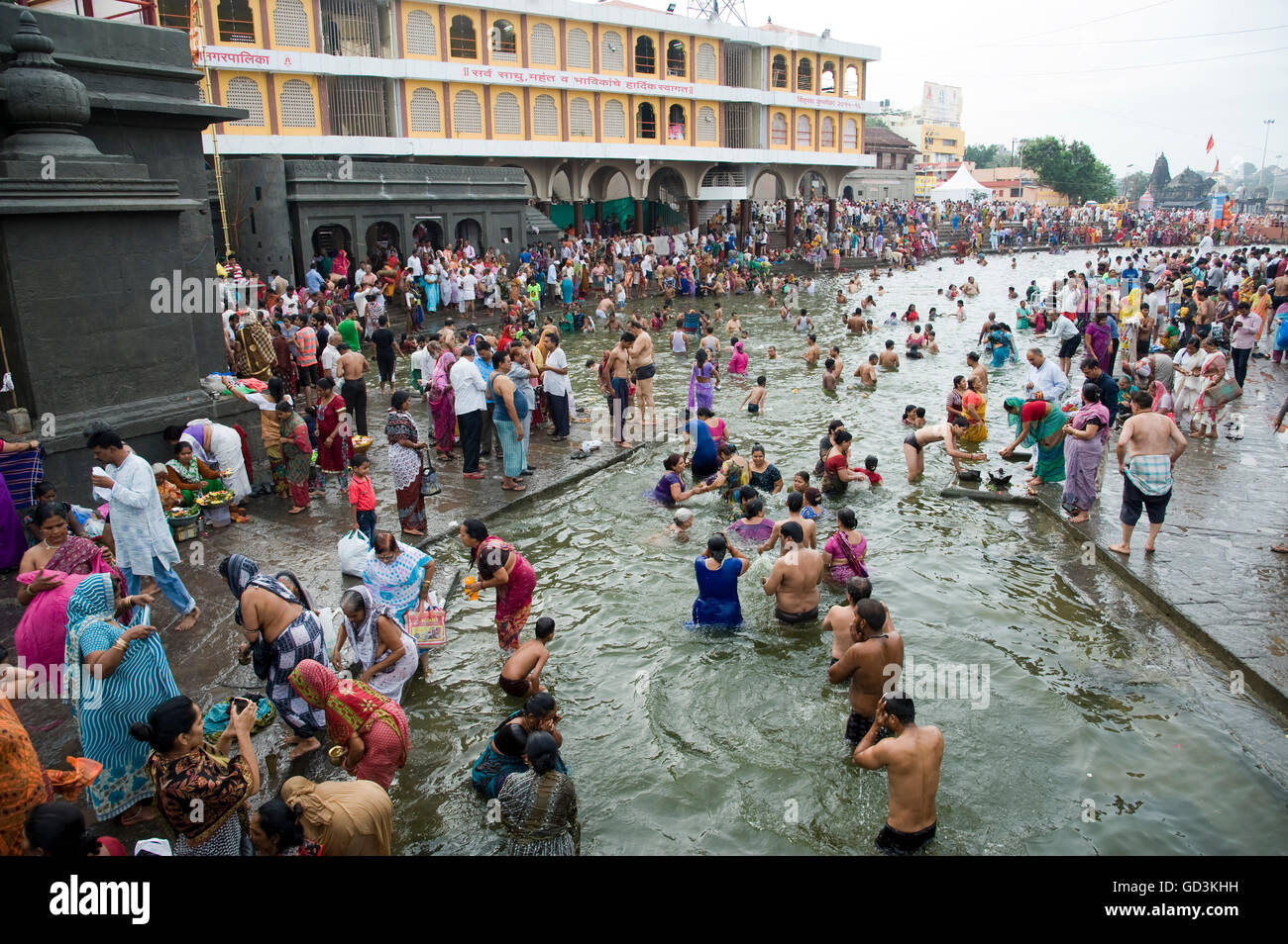 Devotees bathing in godavari river, kumbh mela, Nasik, maharashtra ...