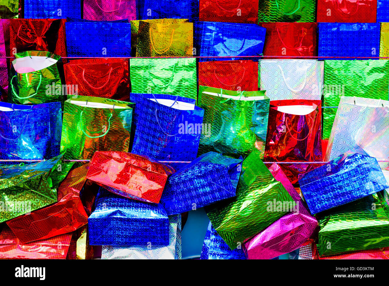 Assortment of very colorful small gift bags Stock Photo - Alamy