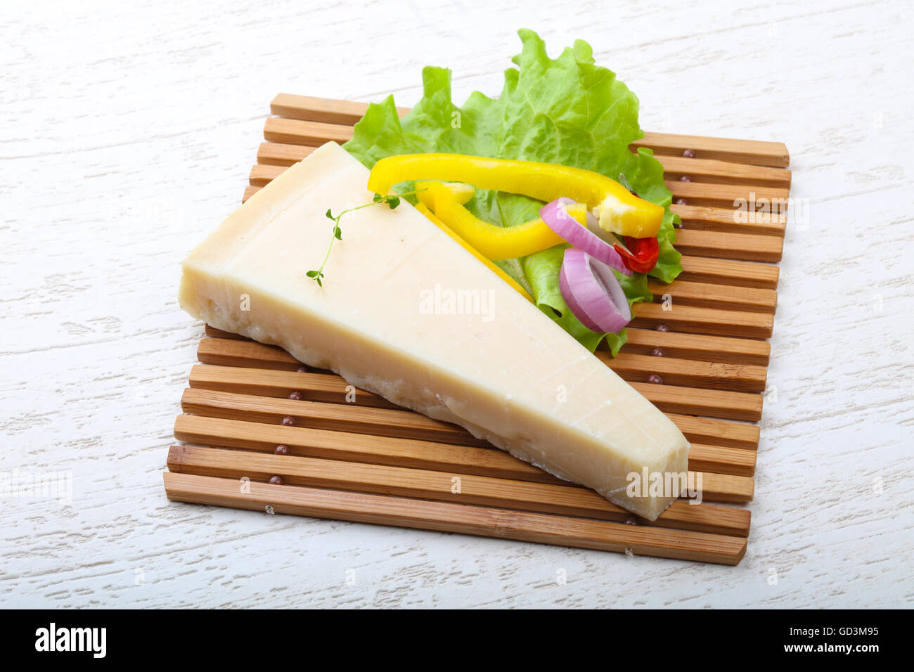 Parmesan cheese triangle on the wood background Stock Photo - Alamy