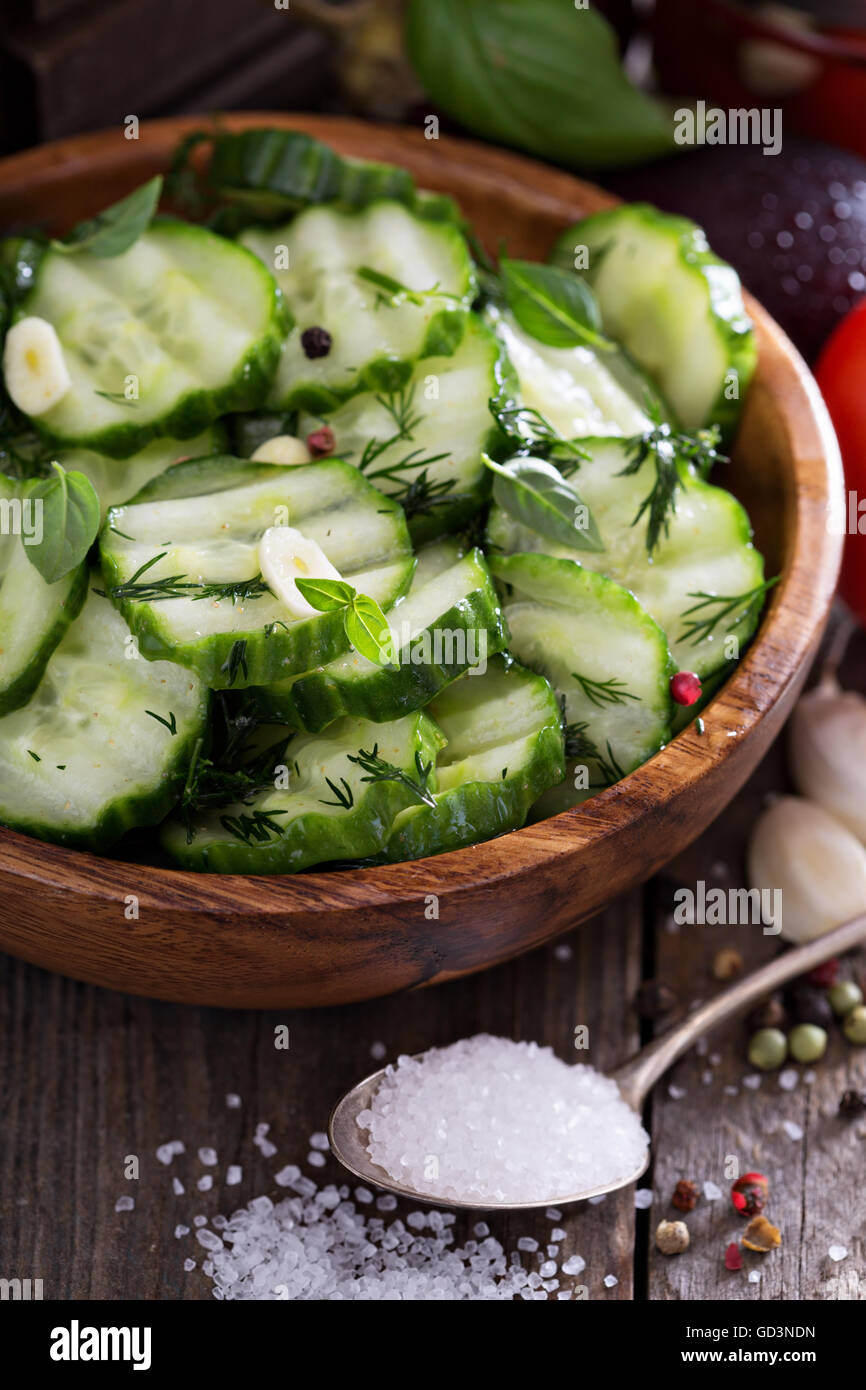 Pickled cucumber in a rustic wooden bowl Stock Photo - Alamy