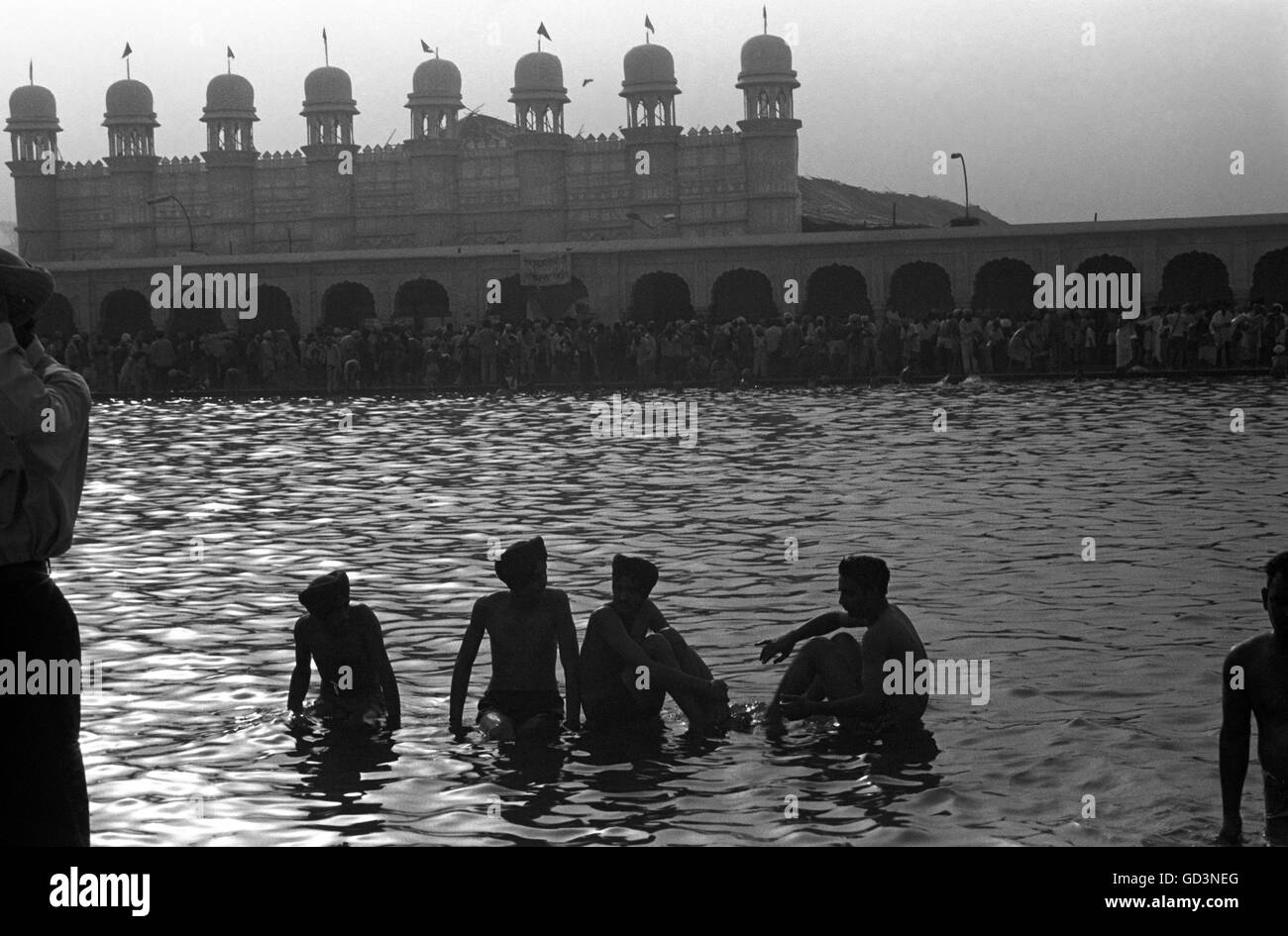 Men taking a holy dip Stock Photo - Alamy