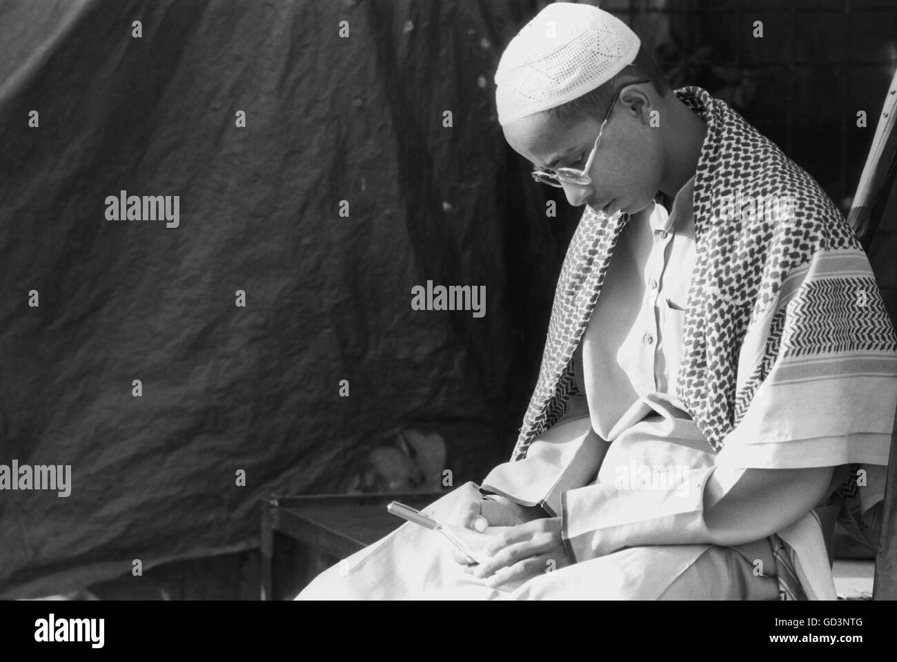 A muslim boy reading a book Stock Photo - Alamy