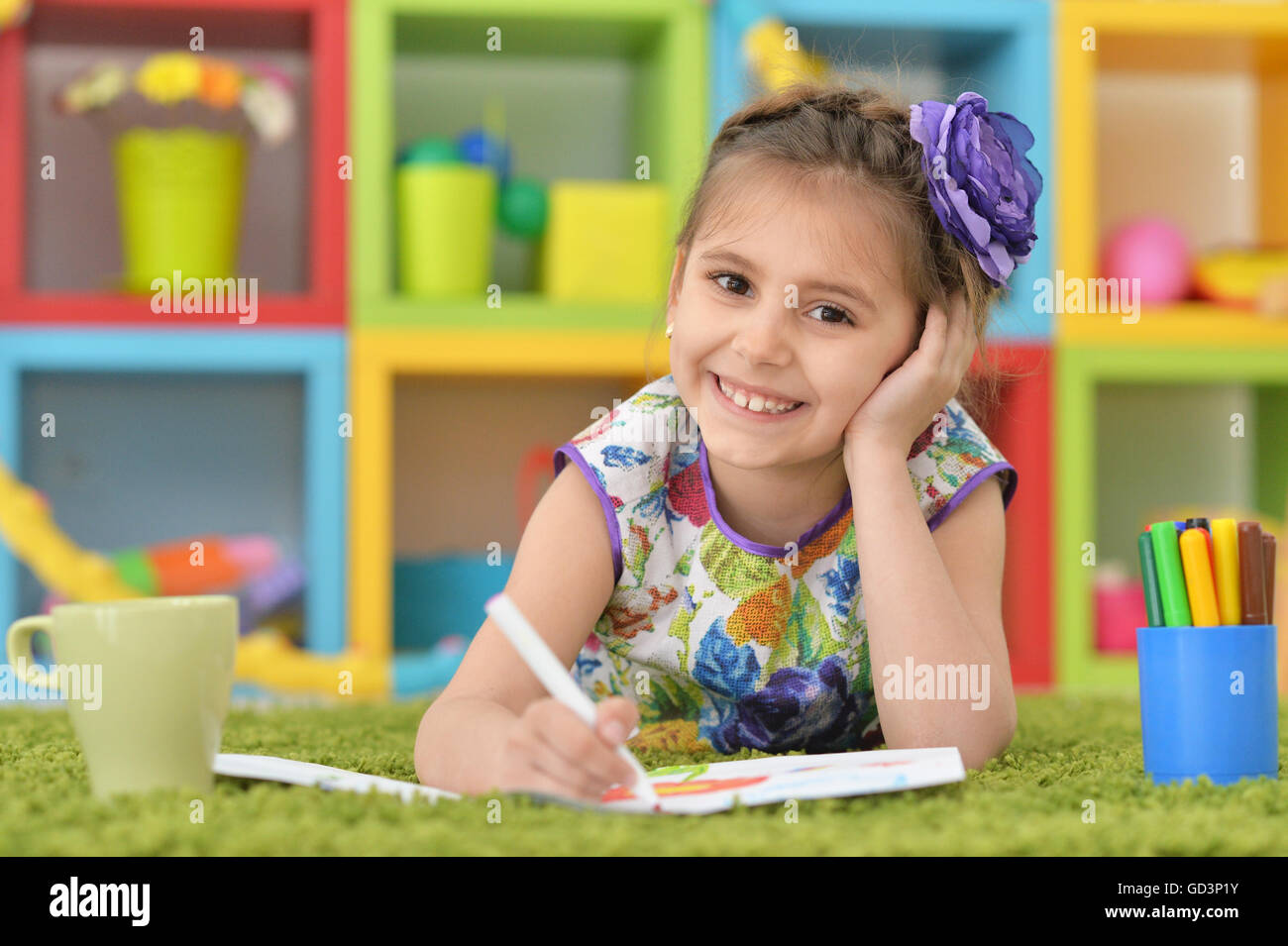 Little girl drawing at class Stock Photo - Alamy
