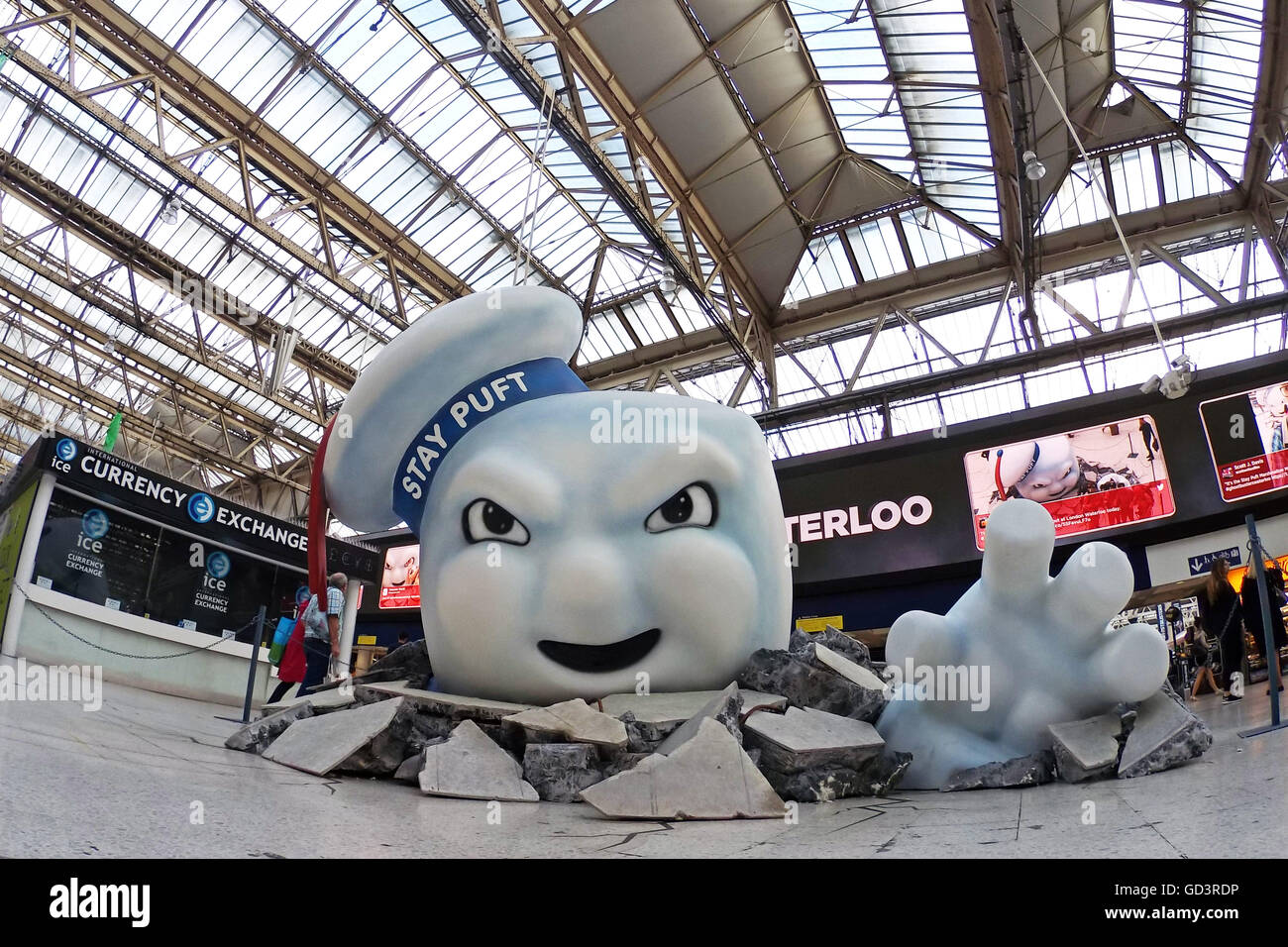 The giant Marshmallow Man from Ghostbusters is seen breaking through ...