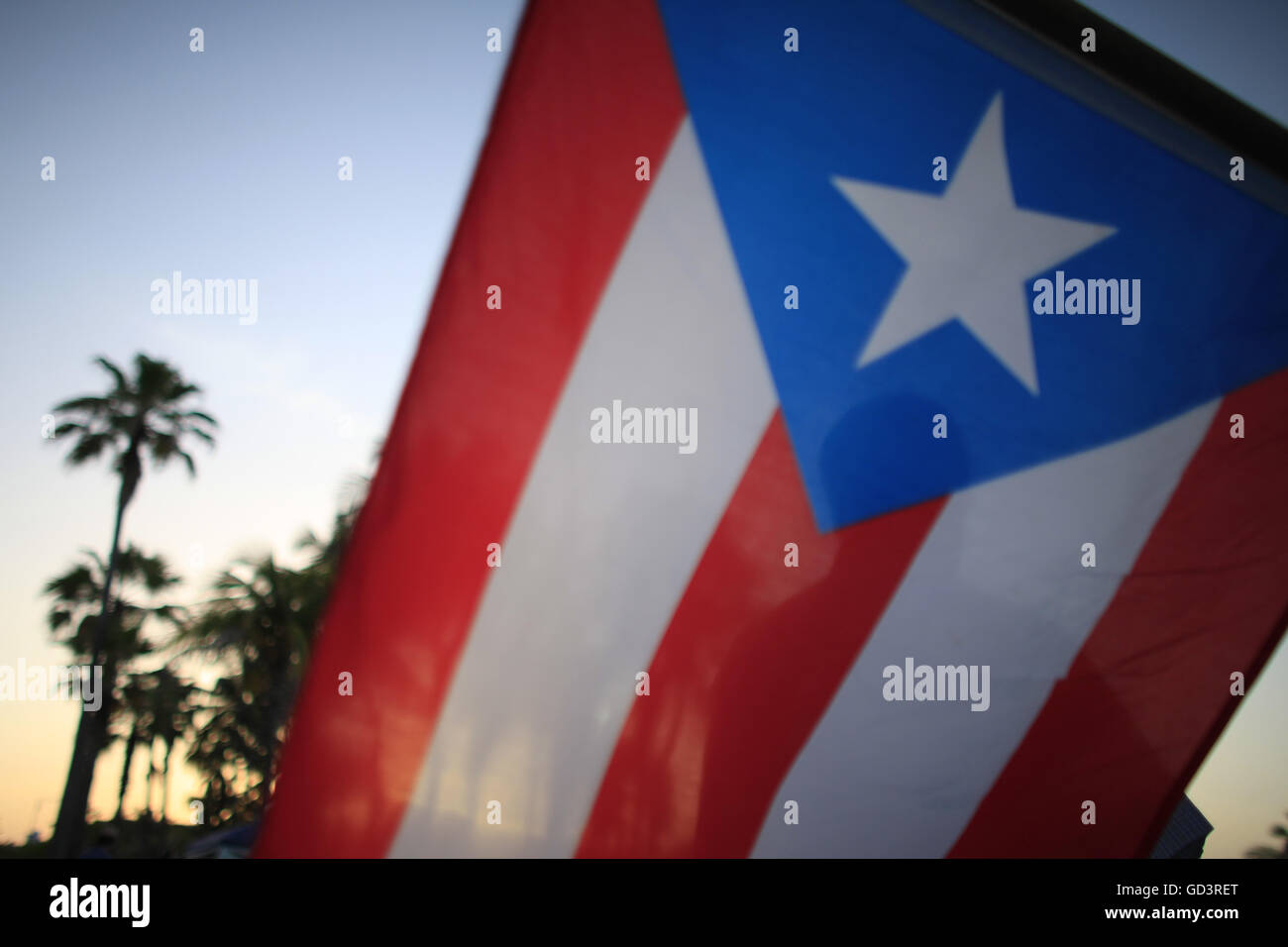 San Juan, Puerto Rico. 30th Apr, 2015. A man holds the Puerto Rican ...