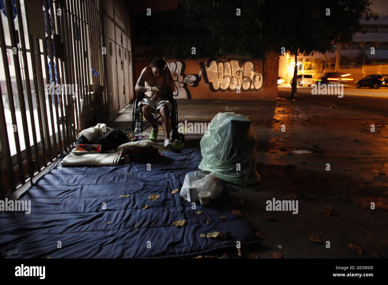 San Juan, Puerto Rico. 21st June, 2013. A homeless man sits in his ...
