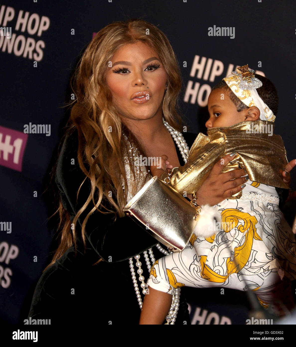 New York, USA. 11th July, 2016. Hip hop artist LIL' KIM and her son ...