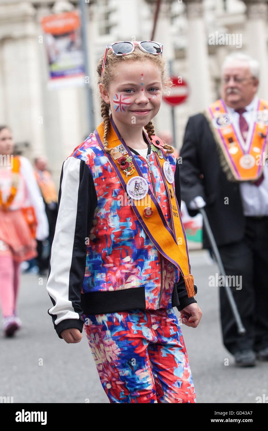 Belfast, UK. 12th July 2016. A young girl wearing a Loyal Orange order ...