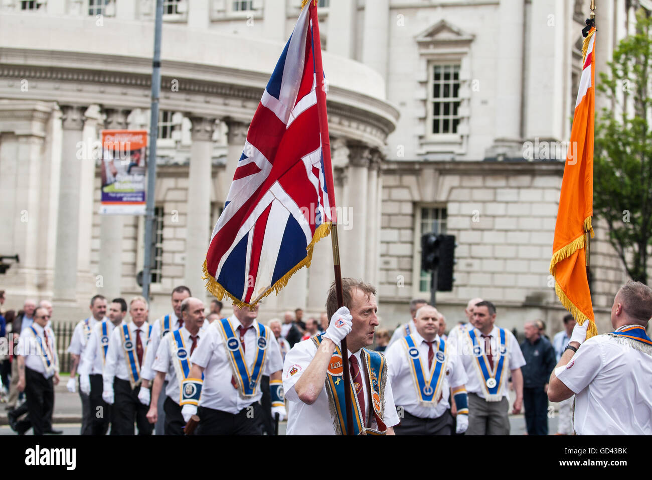 Belfast, UK. 12th July 2016. An Orangemen holding a Union flag ...