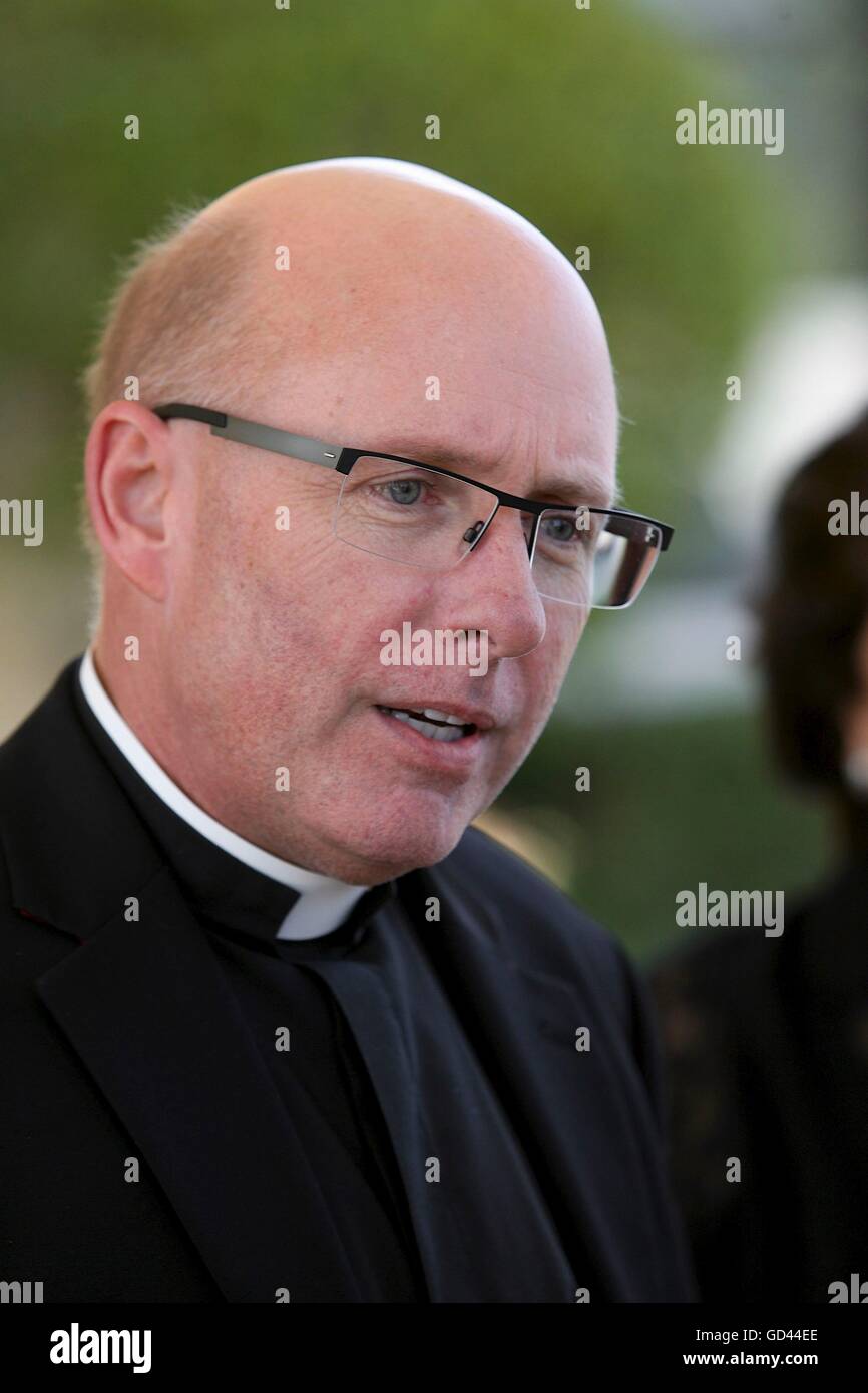 Dallas, Texas, USA. 12th July, 2016. Father Michael Forge speaks to the ...