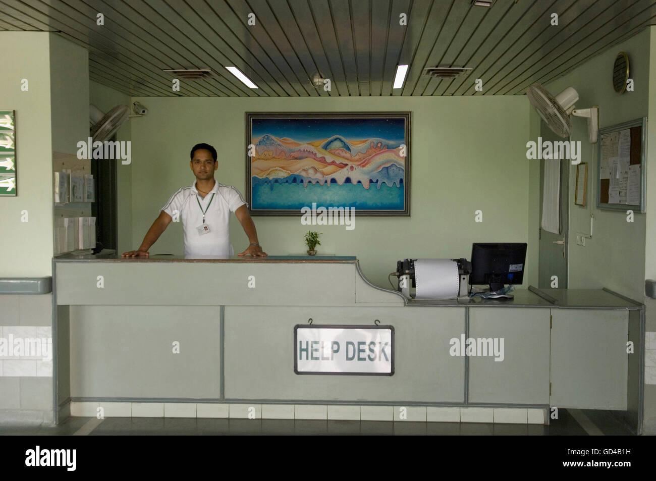 Man on help desk Stock Photo - Alamy