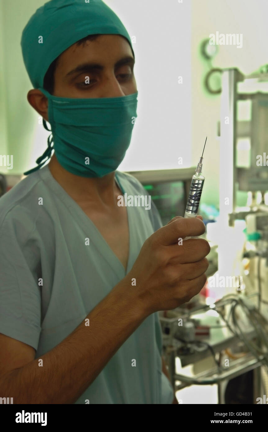 Doctor with syringe Stock Photo - Alamy