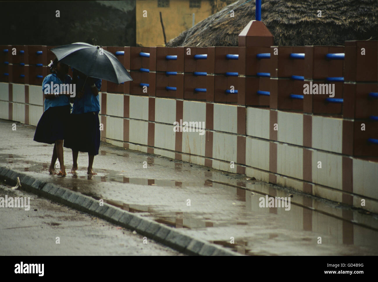School girls walking in the rain Stock Photo - Alamy