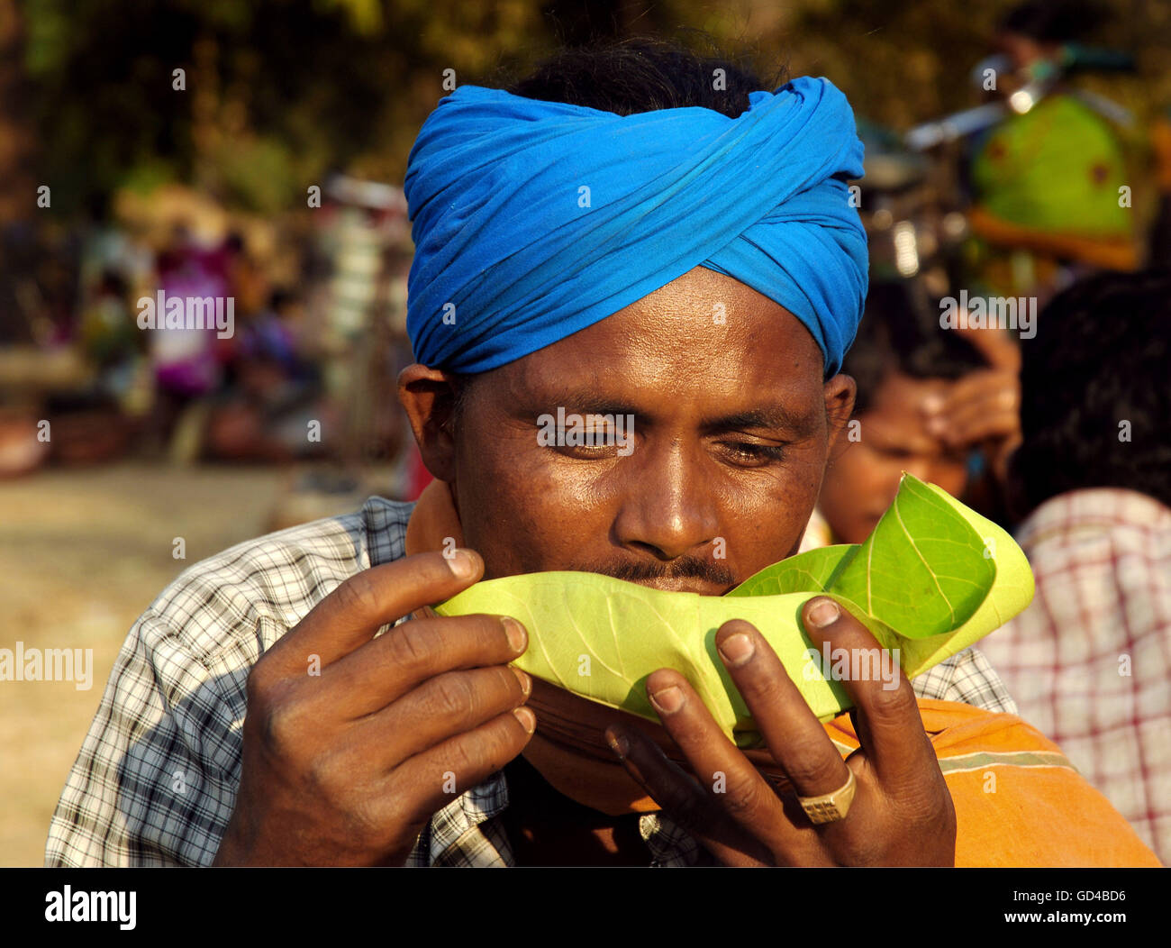 Tribal man drinking Salfi Stock Photo - Alamy