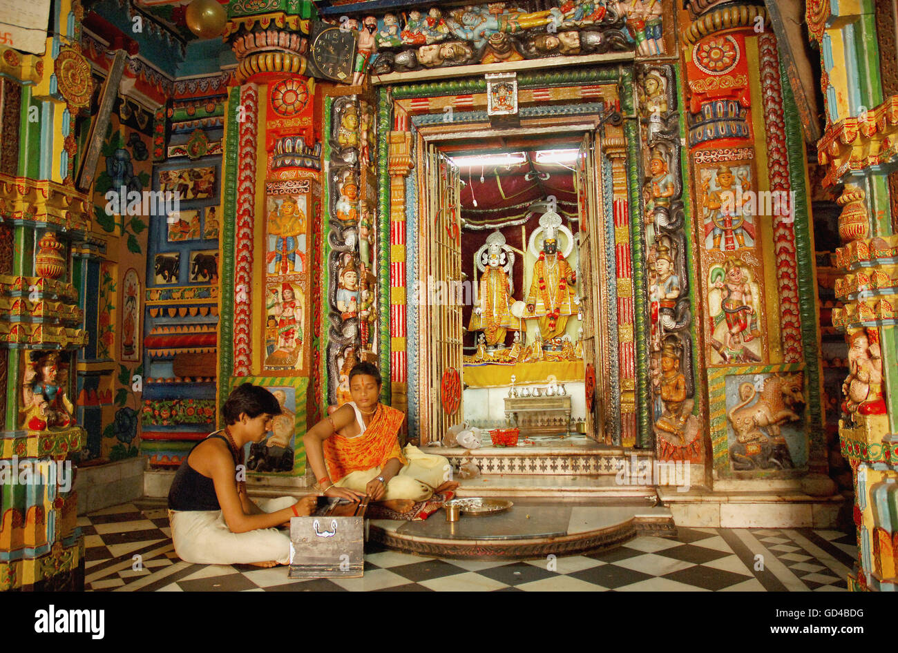 Devotees in temple Stock Photo - Alamy