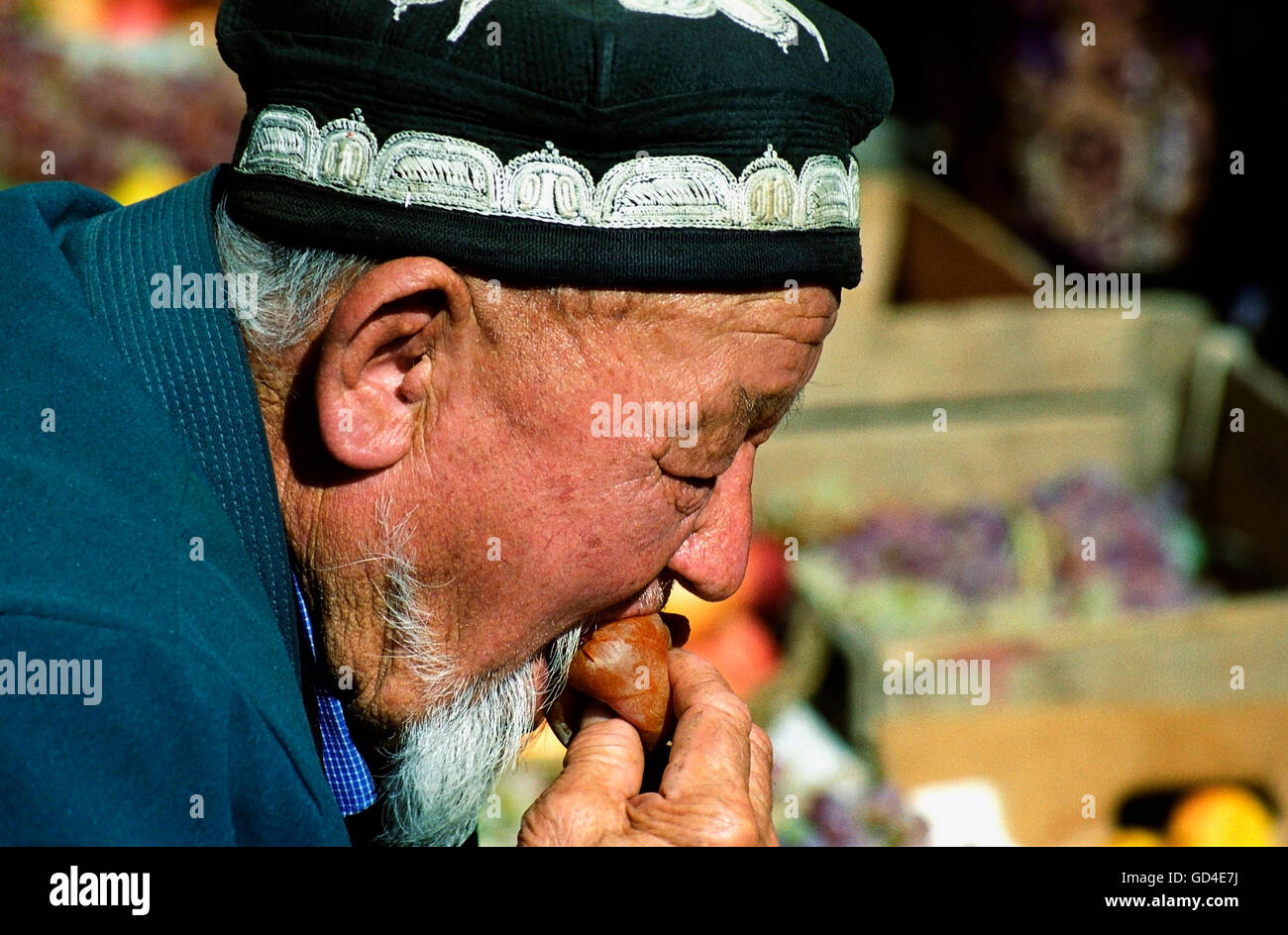A Muslim man eating fruit Stock Photo - Alamy
