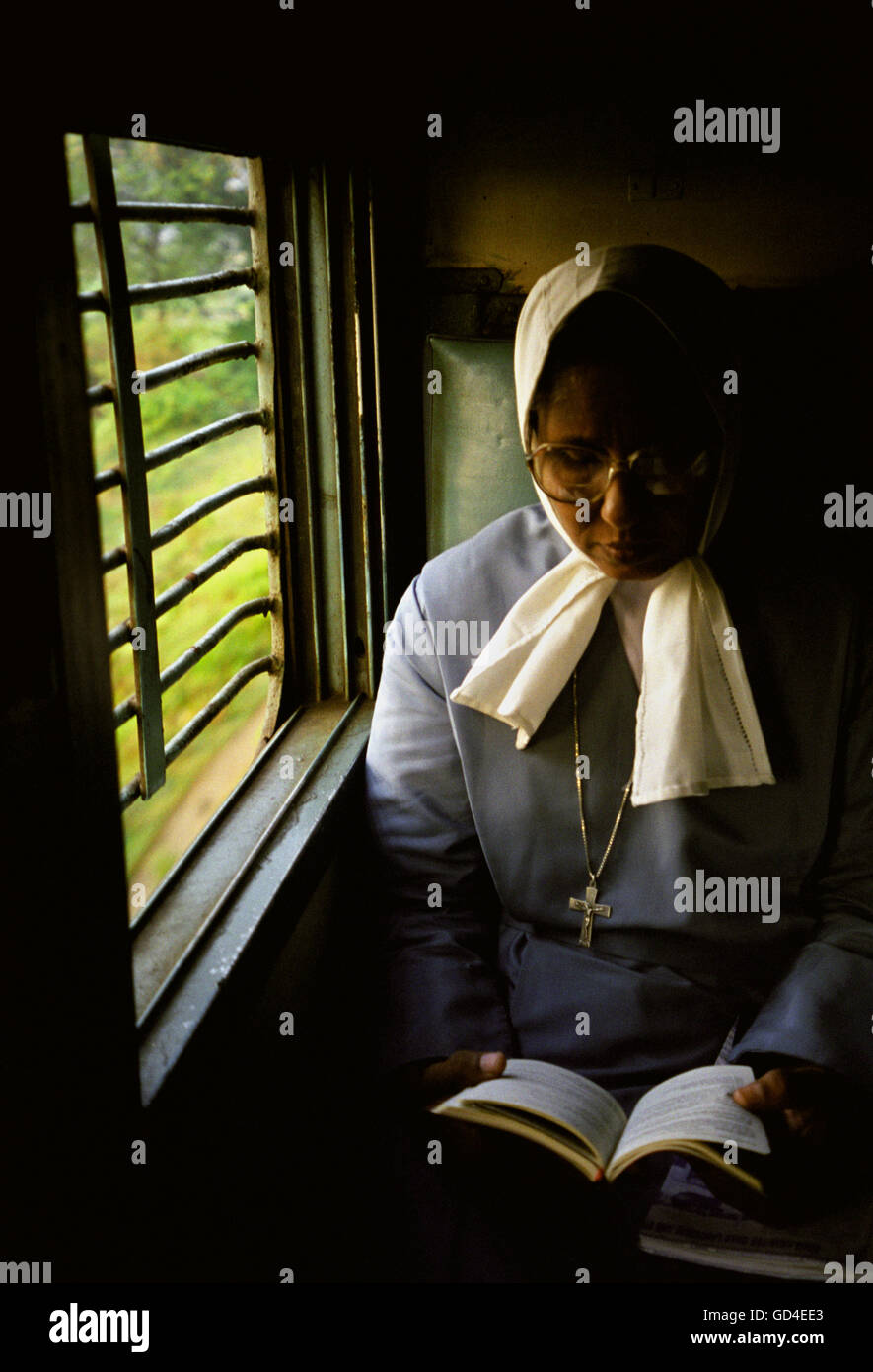A nun reading a Book Stock Photo - Alamy