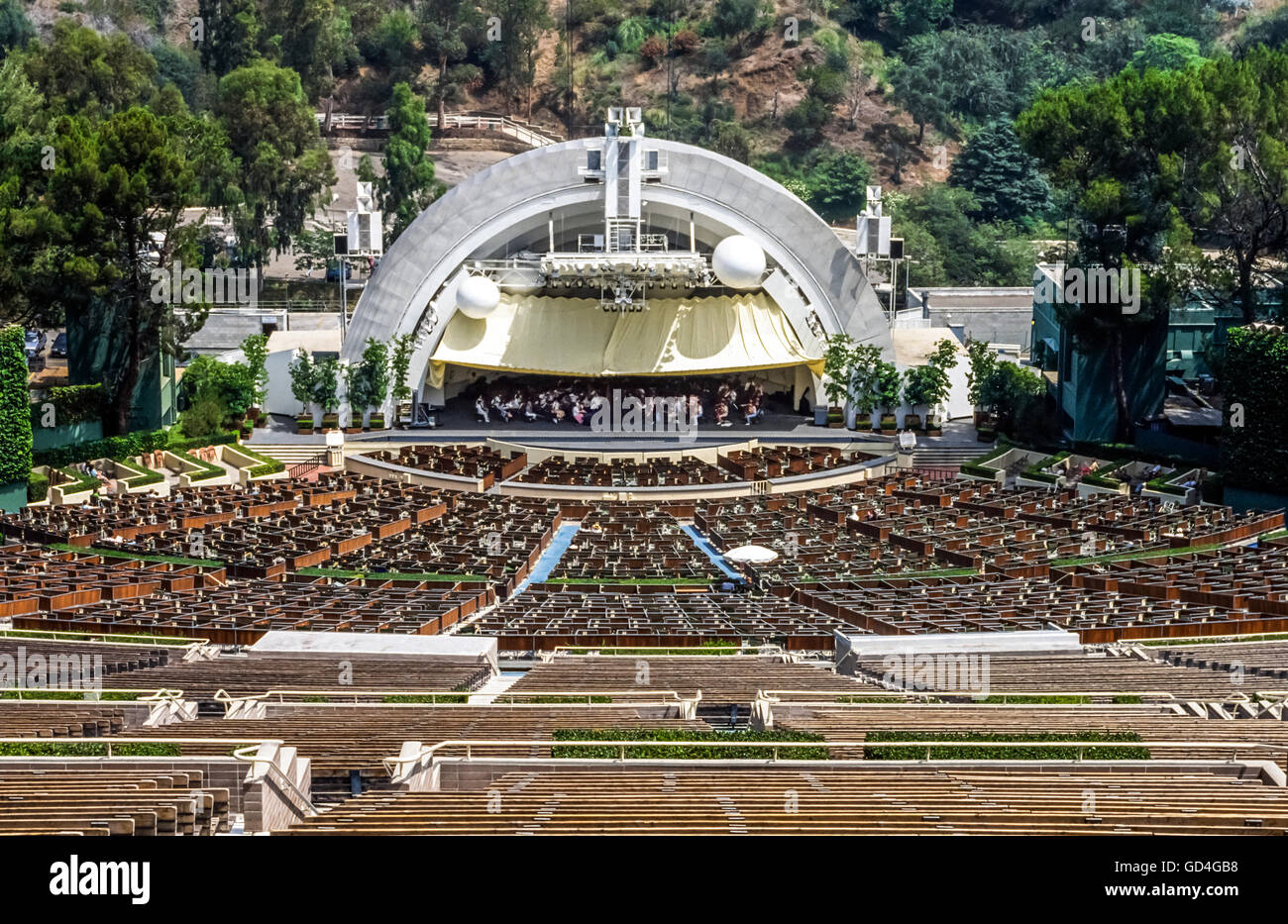 An orchestra rehearses on stage before 17,376 sloping empty seats in ...